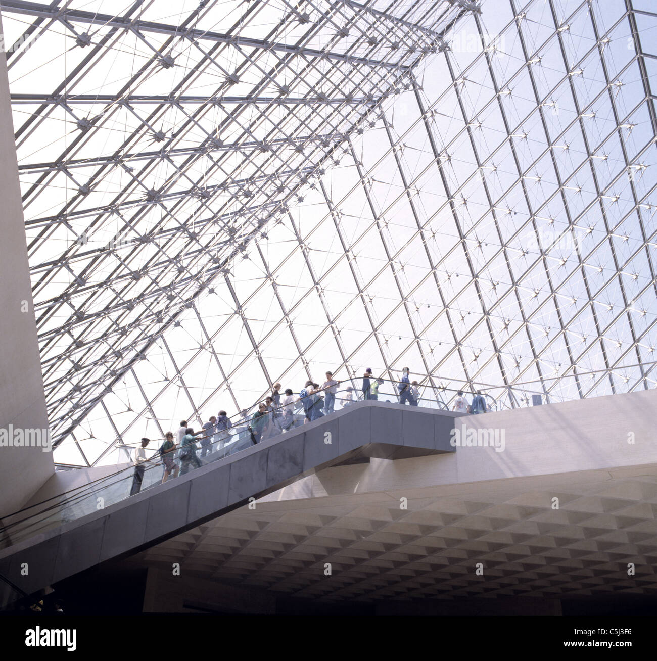 Group of people waiting in queue on staircase of pyramid extension of ...