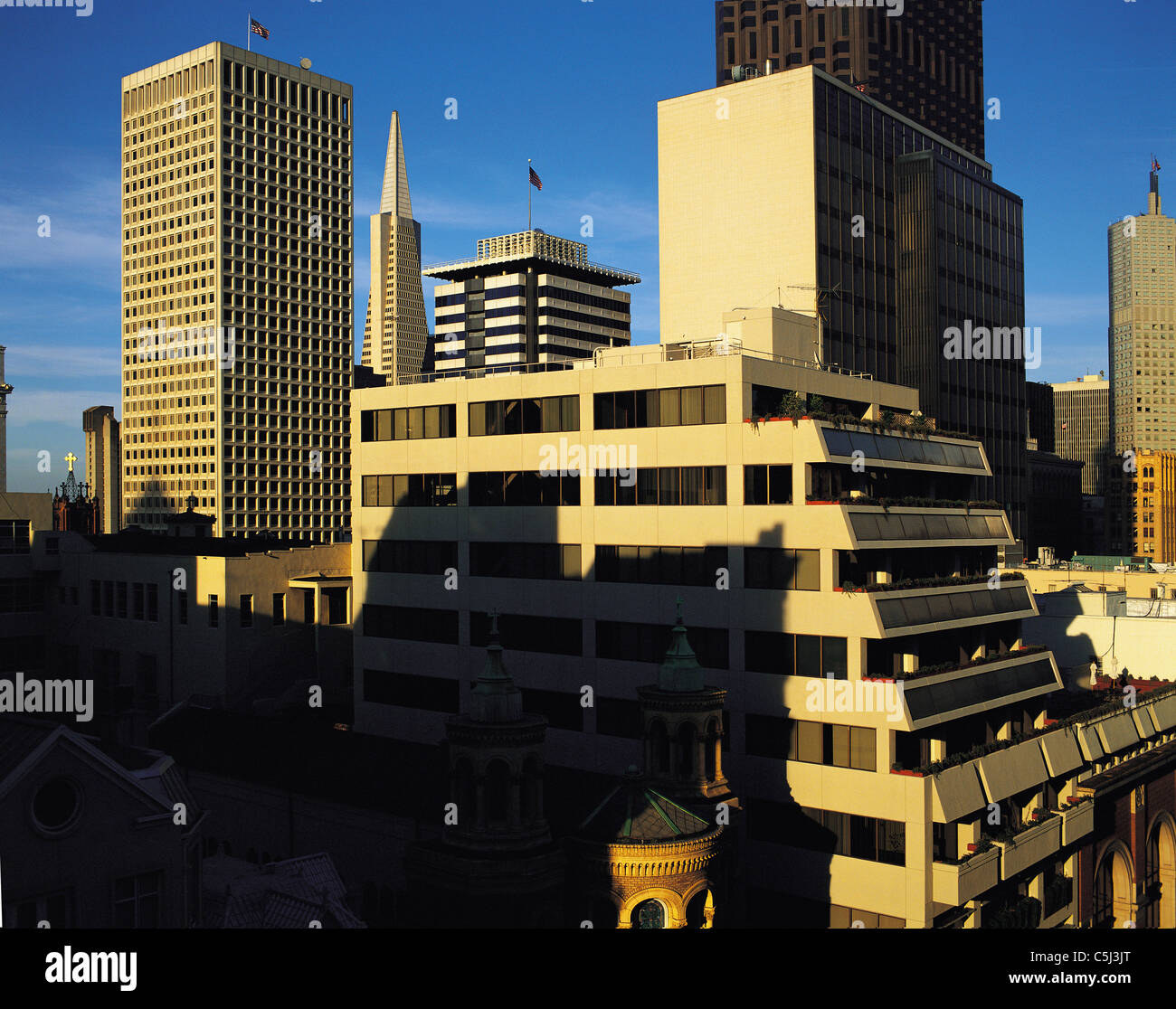 High-rise buildings in downtown San Francisco, in evening light ...