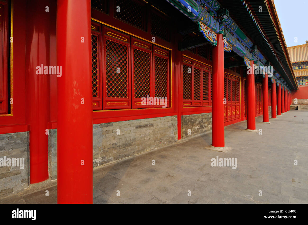 Red-painted, pillared and highly decorative facade of a painted ...