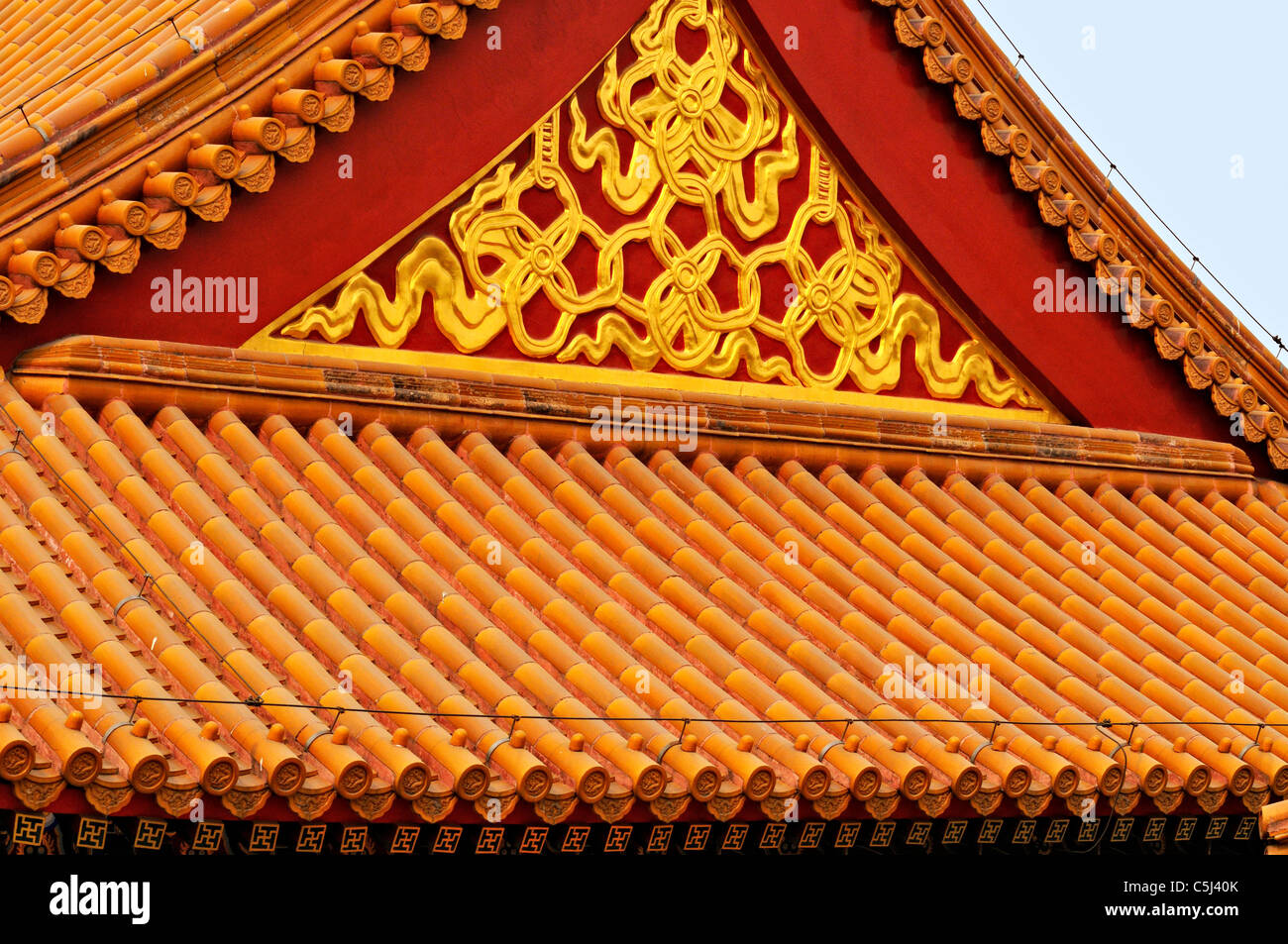 Detail of roof with gable decorated in the sacred colours of red and ...