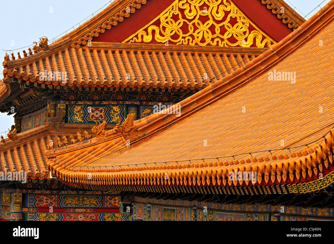 Detail of roofs with gable decorated in the sacred colours of red and ...