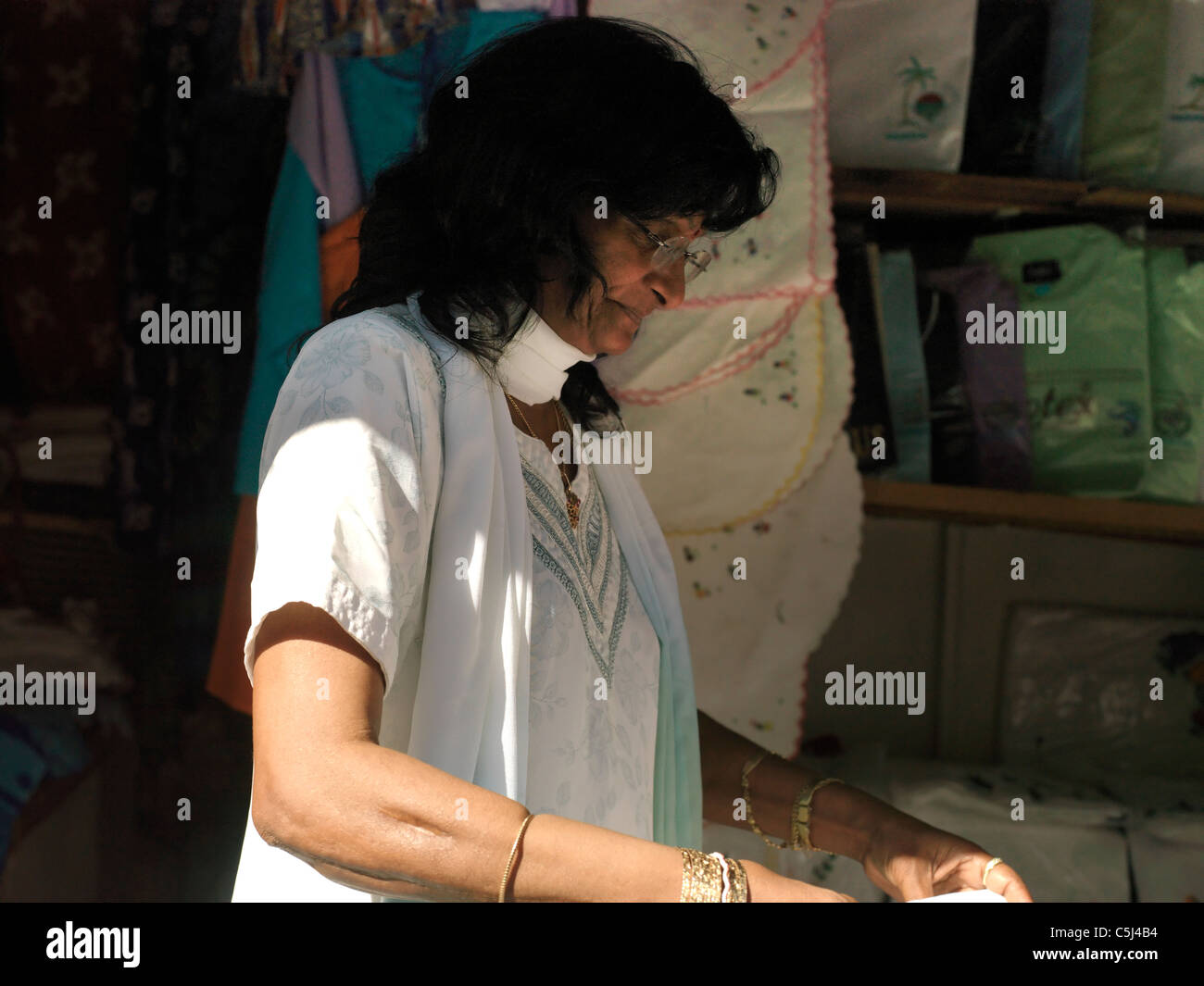 Woman selling clothes hi-res stock photography and images - Alamy