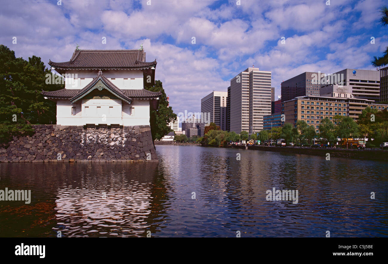 Moat and fortified perimeter wall of Imperial Palace with background of ...