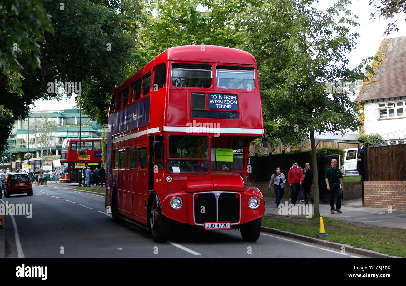Red doubledecker buses are used as shuttle service at Wimbledon Stock ...