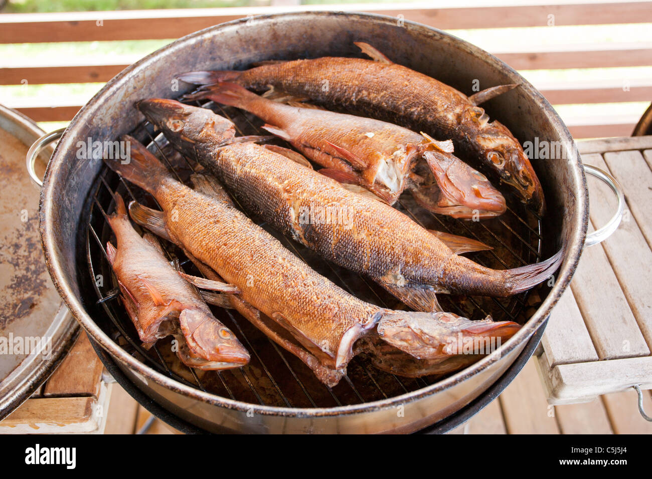 Smoked fish, pikes and perch Stock Photo - Alamy