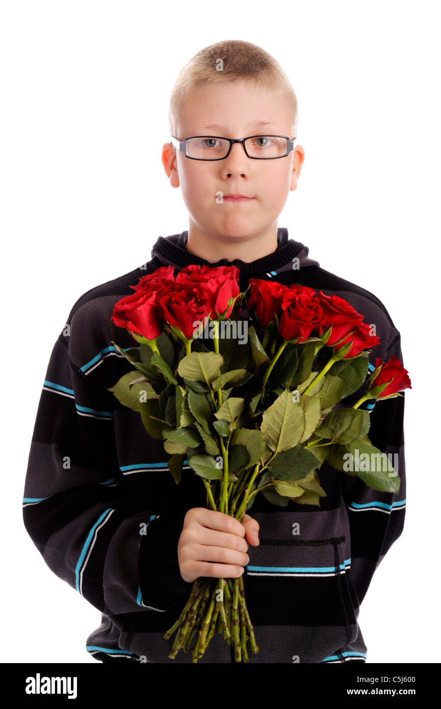 Mothers day : boy with bouquet of red roses. Isolated on white ...