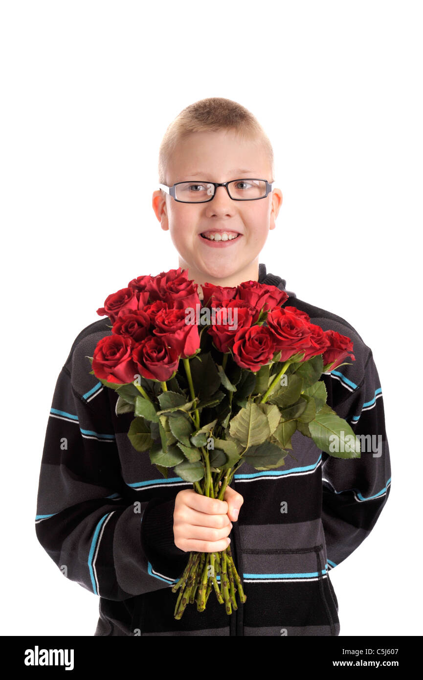 Mothers day : boy with bouquet of red roses. Isolated on white ...