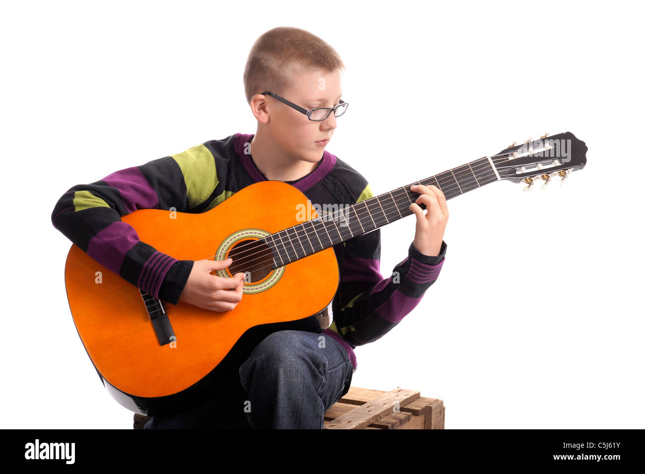 boy playing the accoustic guitar. Isolated on white background Stock ...
