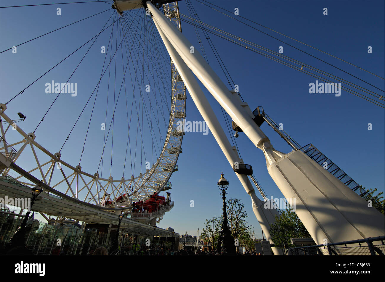 The main wheel and passenger cabins of the London Eye in dramatic back ...