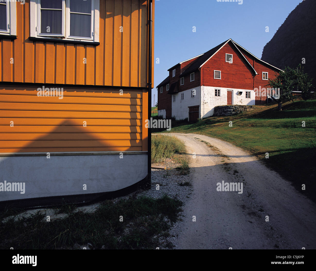 Brightly-coloured traditional Norwegian timber houses in Sogndal in the ...