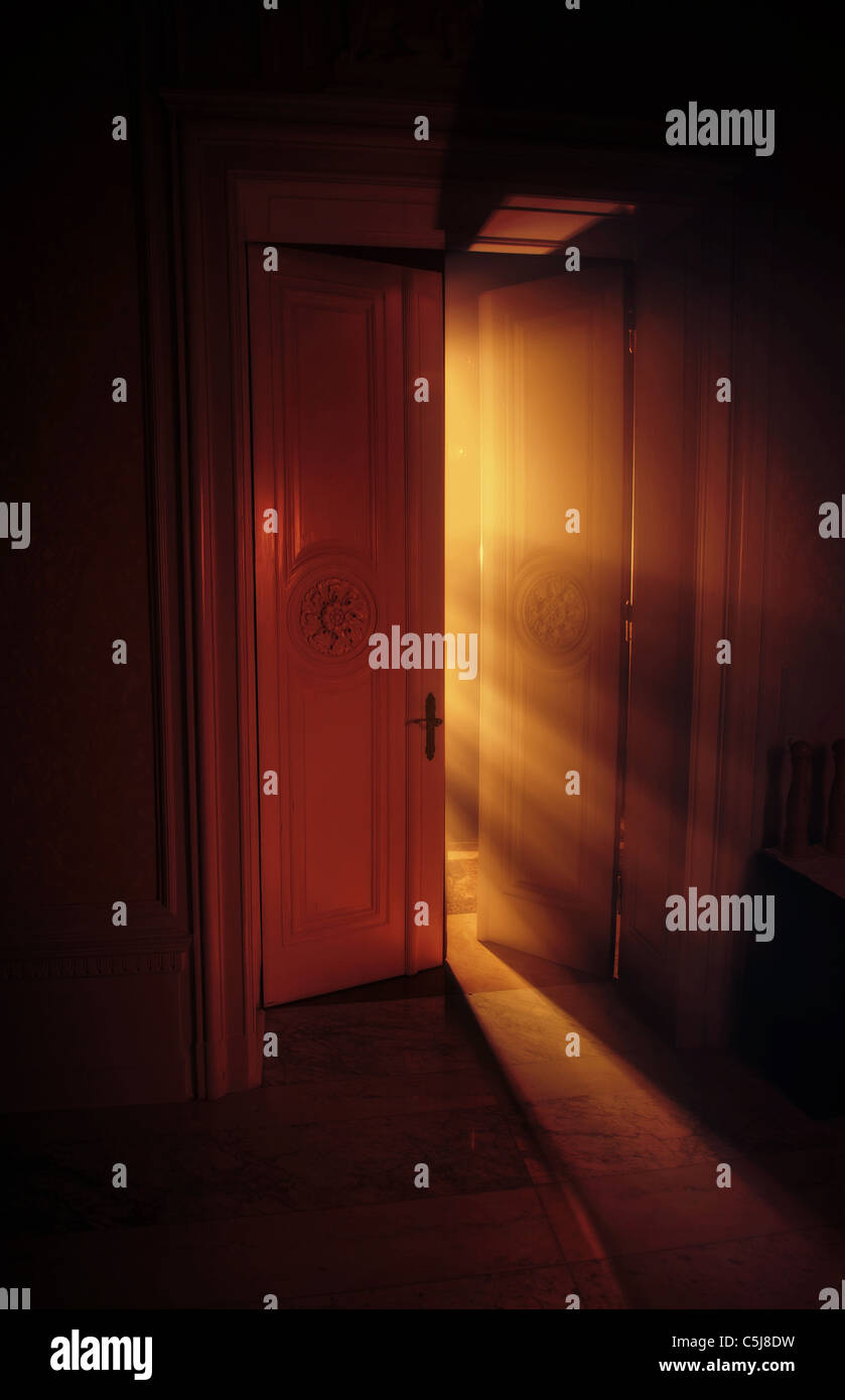 Heavenly rays of light behind the door Stock Photo - Alamy