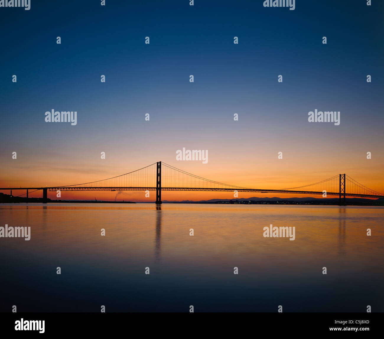 The Forth Road Bridge near Edinburgh, Scotland silhouetted against a ...