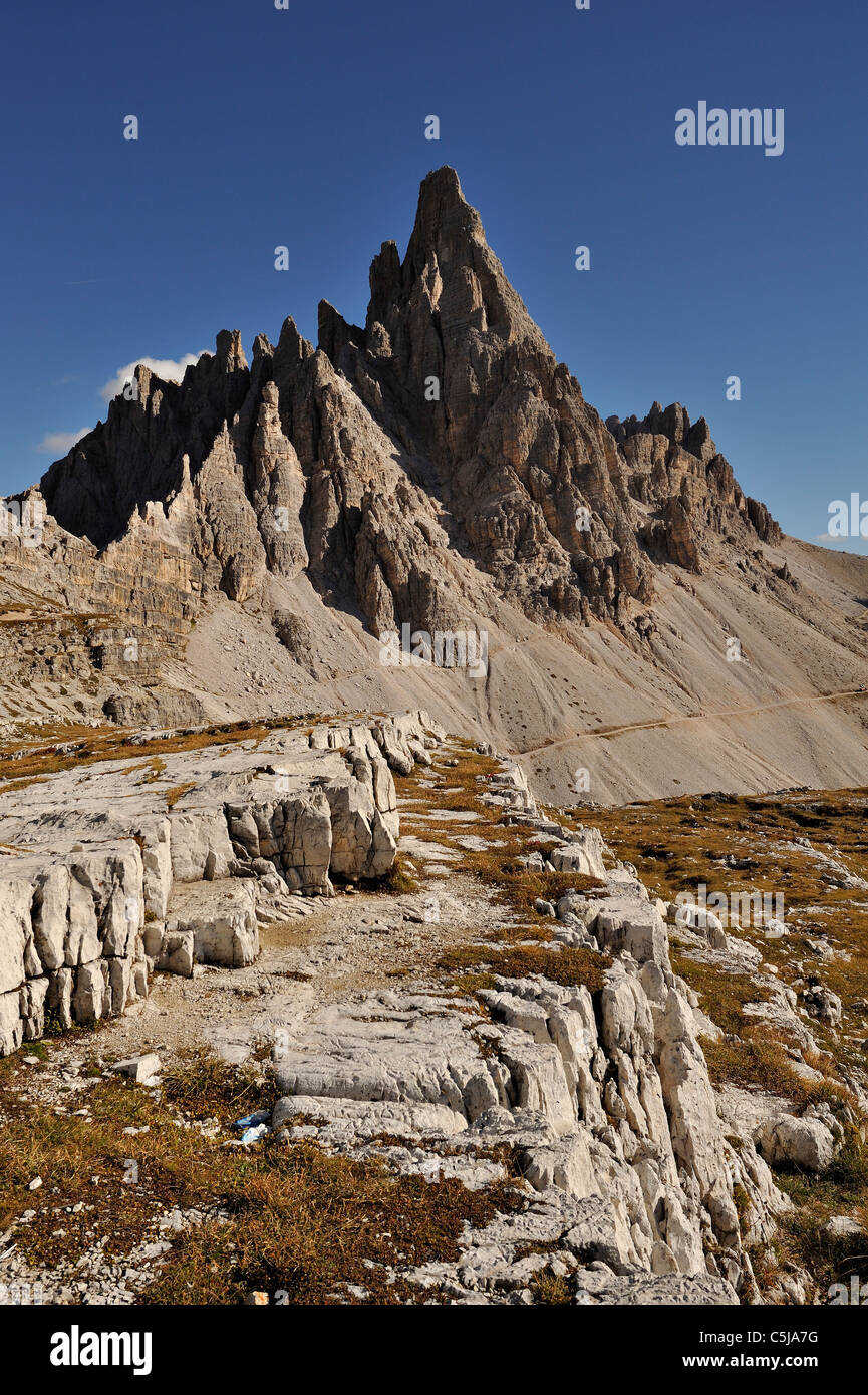 Limestone pavements below the jagged peak of Monte Paterno behind in ...