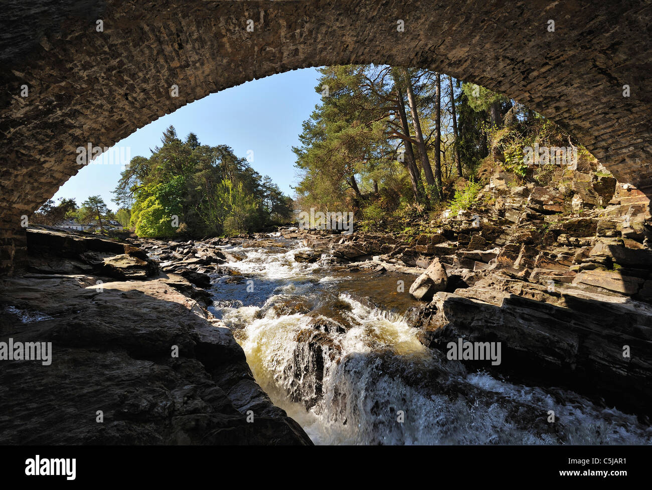 Below the arches of the bridge at the Falls of Dochart, Killin ...