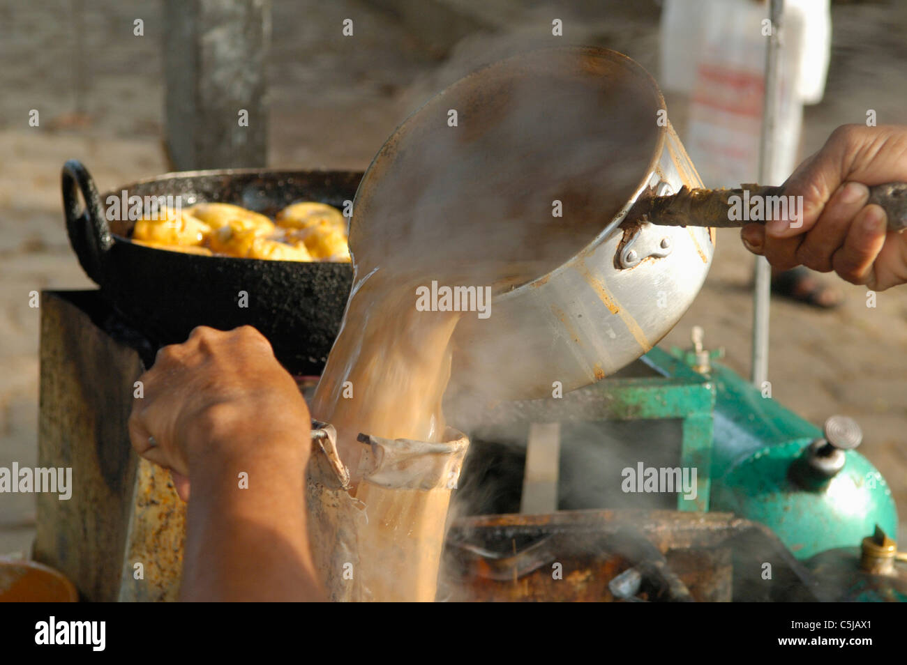 India, Kerala, Fort Cochin (Cochi, Kochi). Tea and streetfood (pakora ...