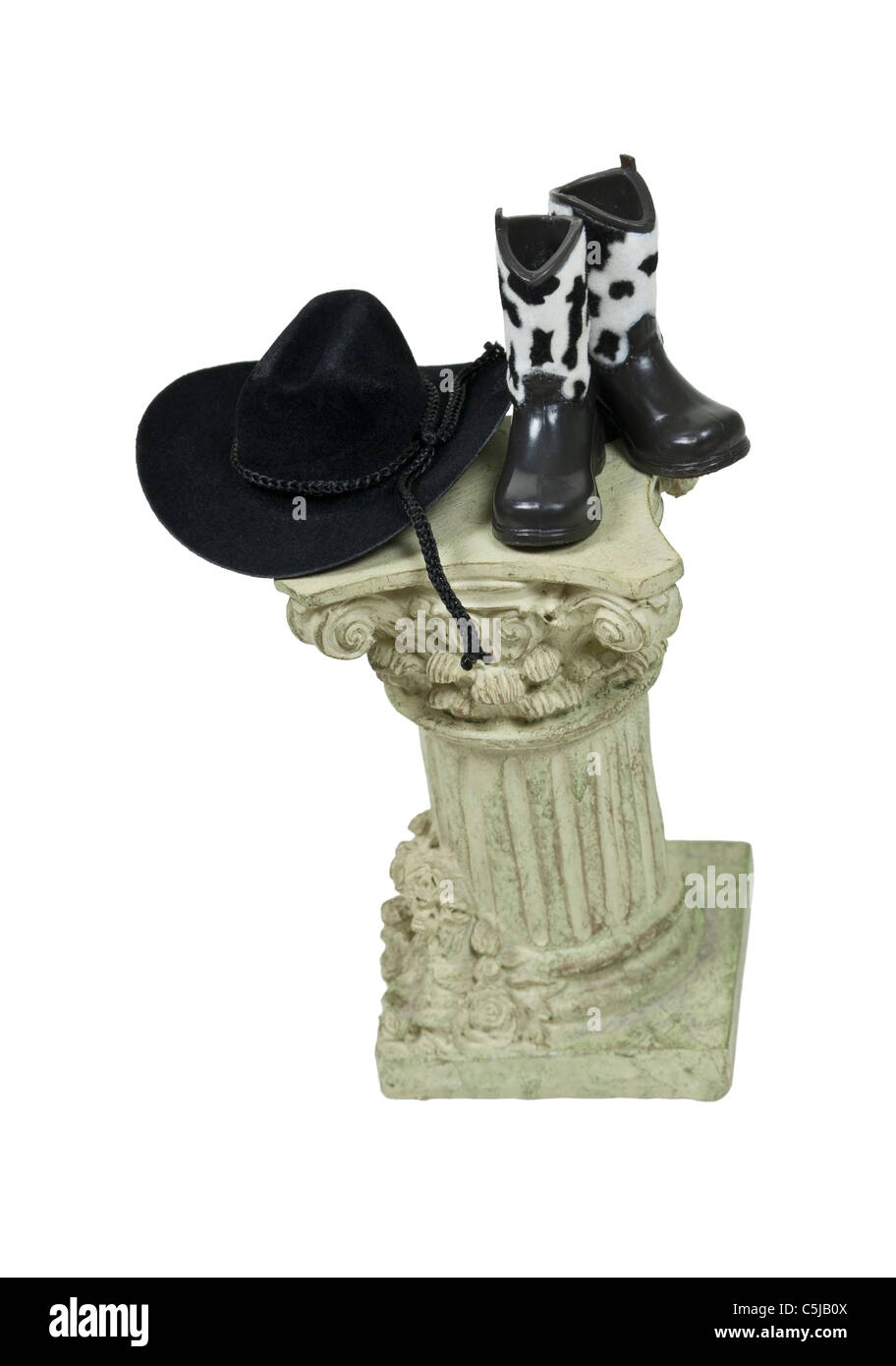 Cowboy boots and hat on pedestal Stock Photo - Alamy