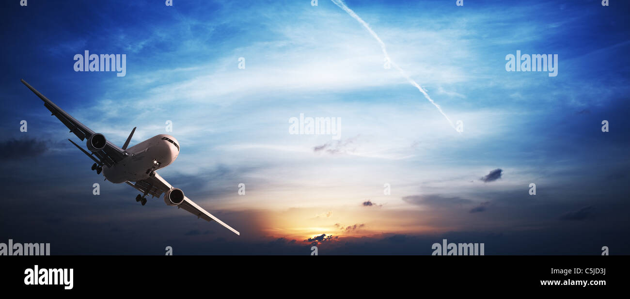 Jet plane in flight. Panoramic image Stock Photo - Alamy