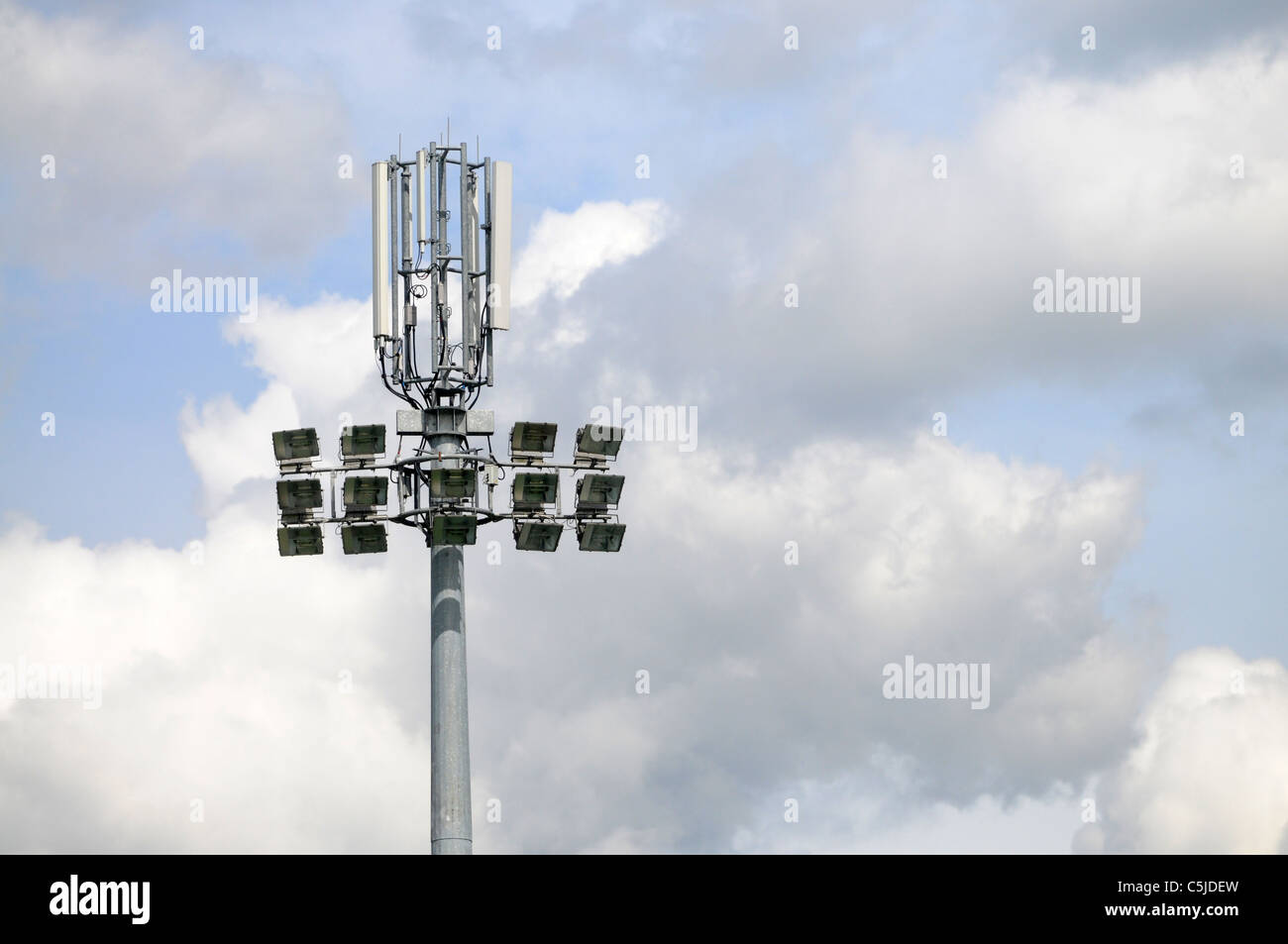 Mobile telephone aerial (mast) transmitter on a football stadium flood ...