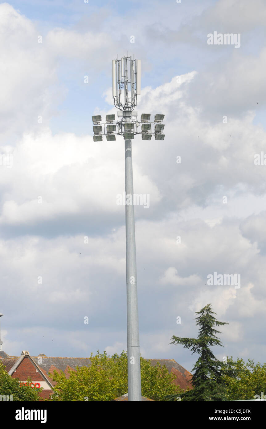 Mobile telephone aerial (mast) transmitter on a football stadium flood ...