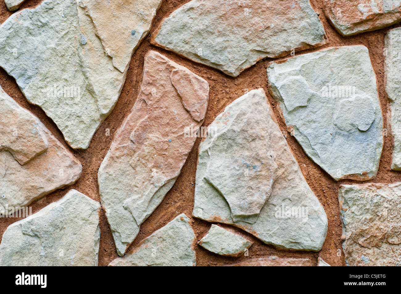 Stone wall background with odd shapes and sizes Stock Photo - Alamy
