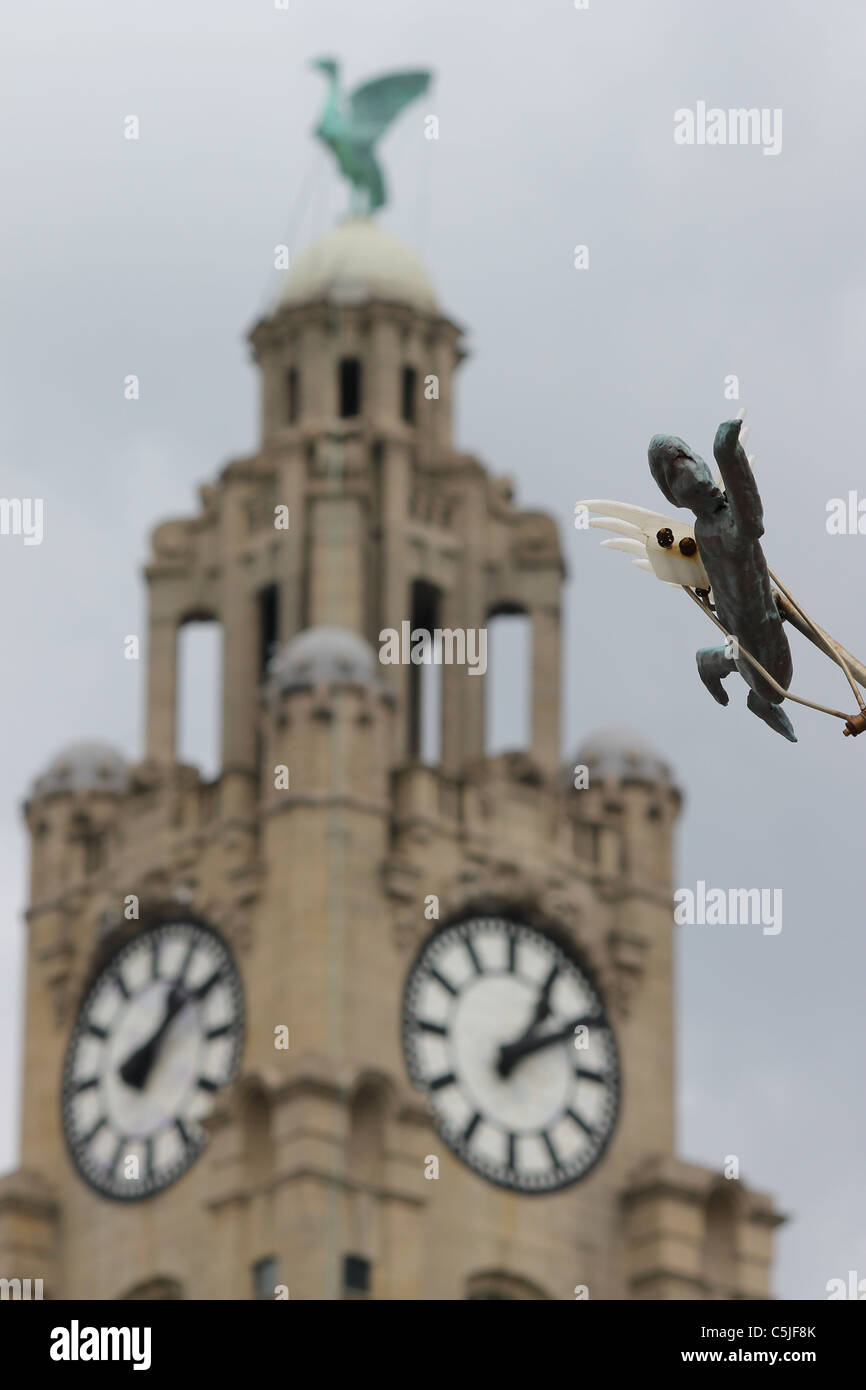 An angel flying neat the to female Liver Bird on the Liver Building ...