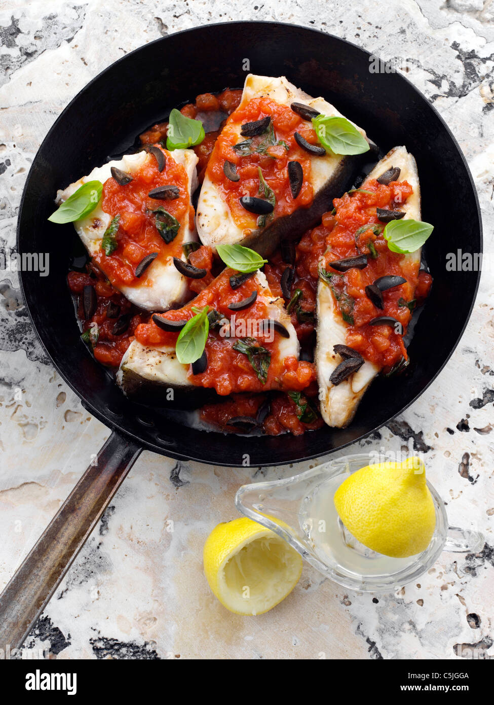 Halibut frying in a pan Stock Photo - Alamy