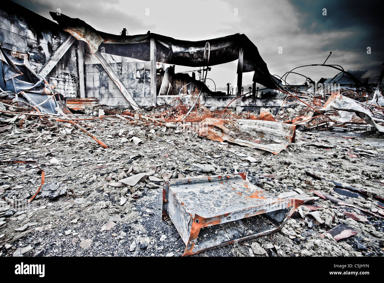 A closed down industrial site with lot of junk and decayed objects ...