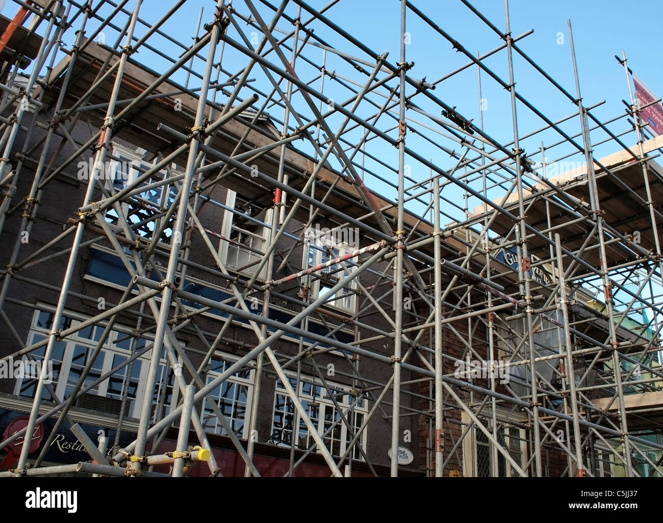 Scaffolding around a fire damaged building Stock Photo - Alamy