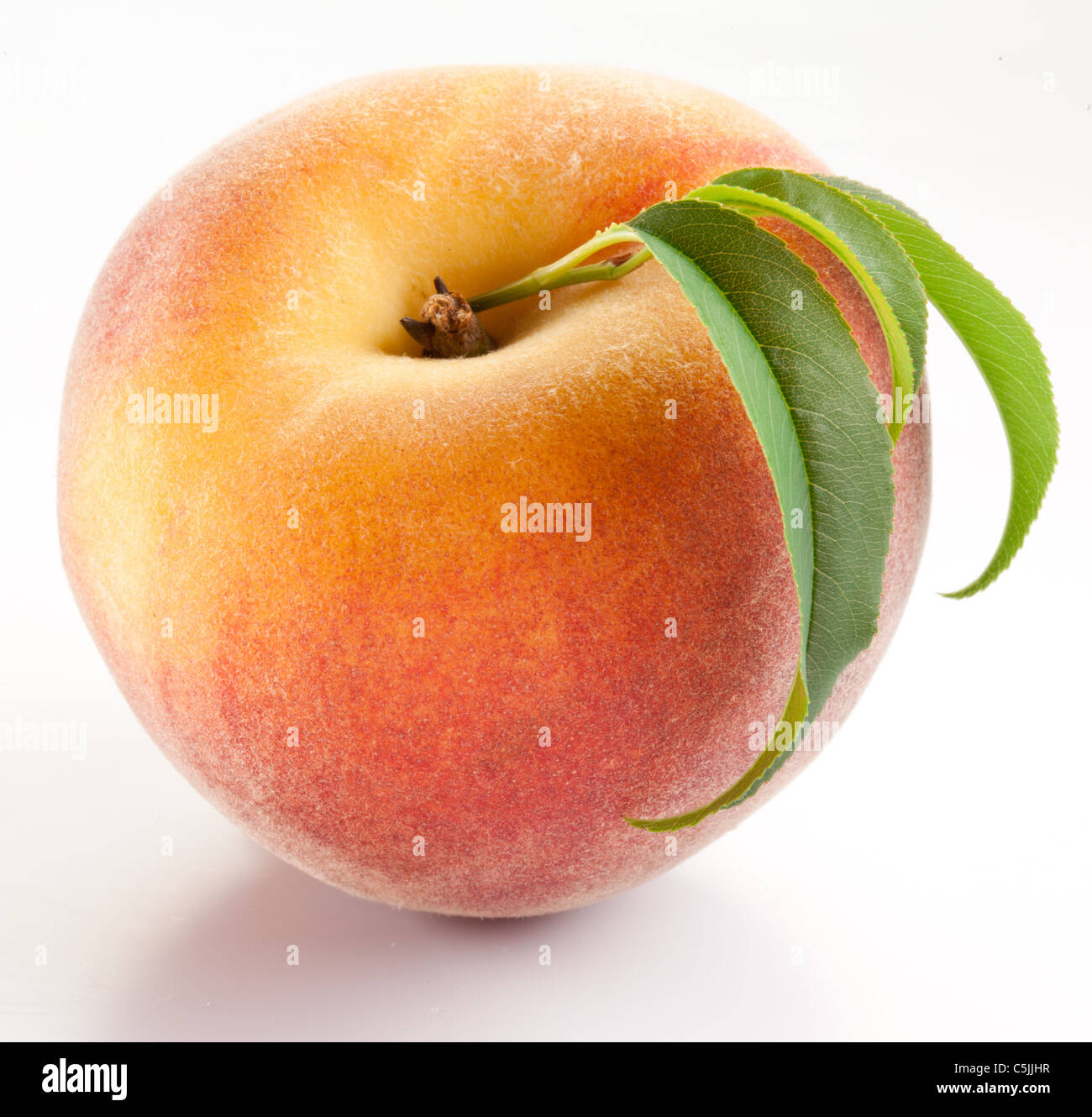 Ripe peach with leaves isolated on a white background Stock Photo - Alamy