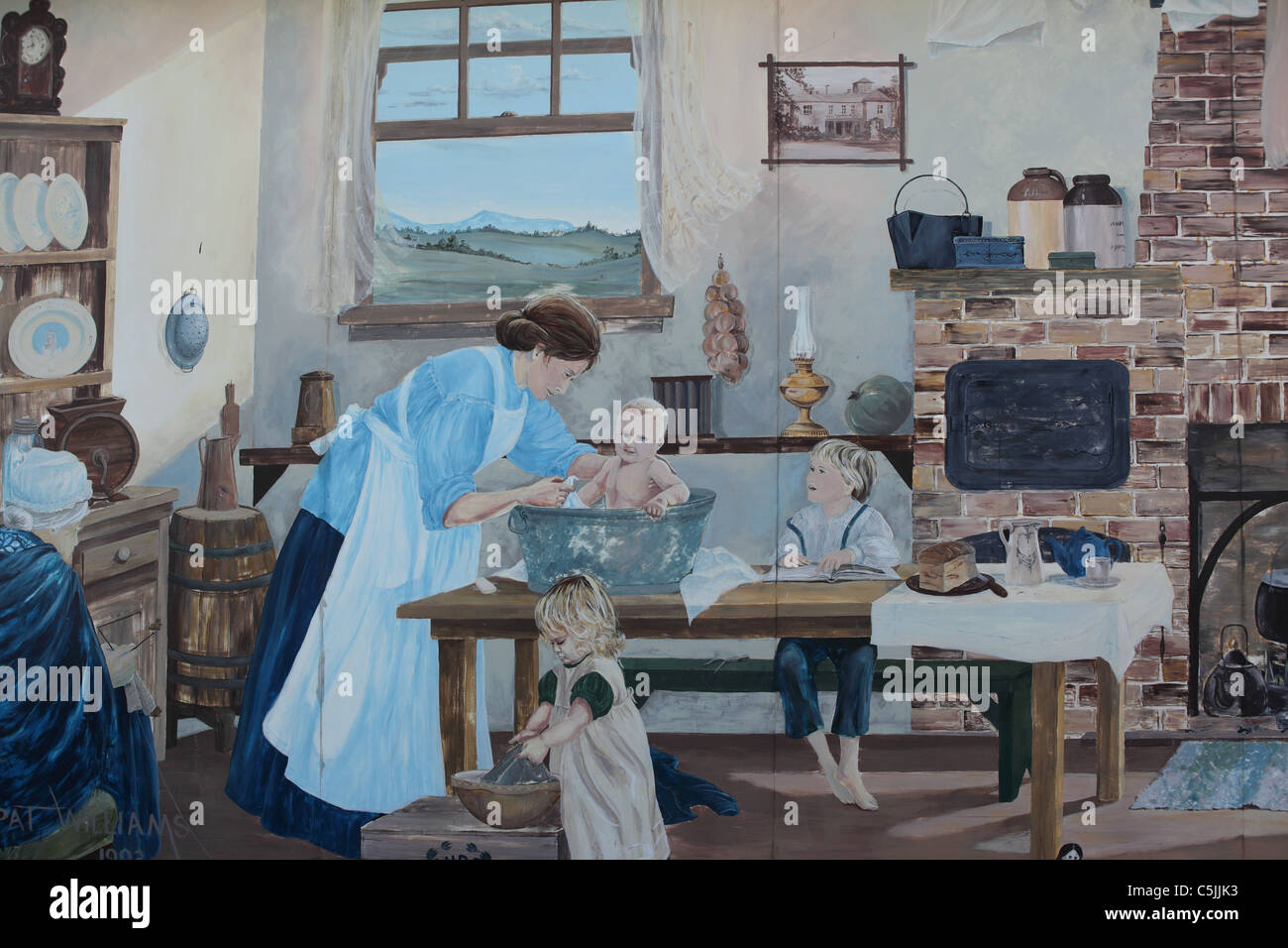 Mural on the side of a building depicting early colonial life around ...