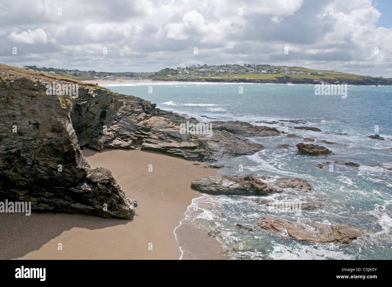 A deserted sandy beach at Hayle Bay, looking towards the more extensive ...