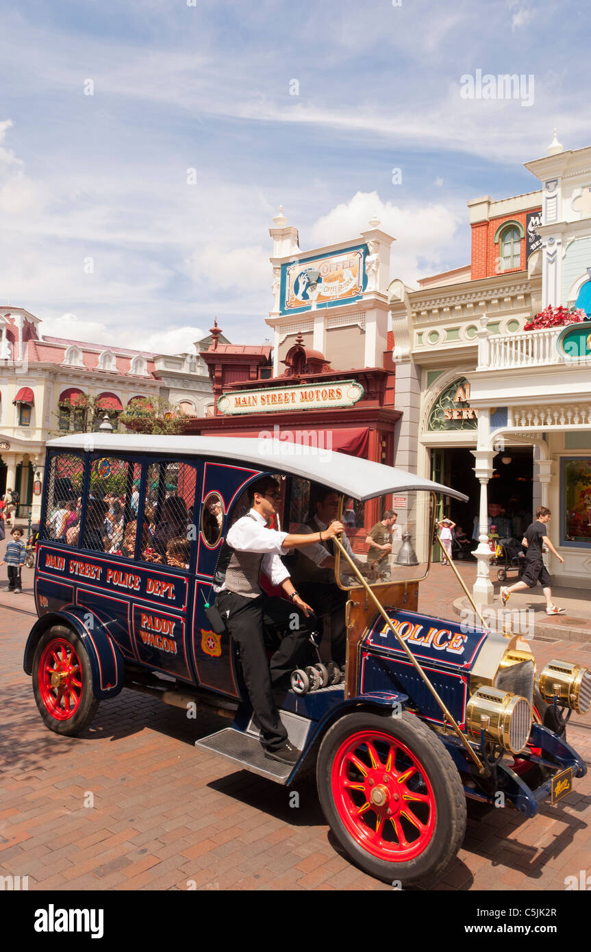 A police car paddy wagon in front of Main Street Motors in the Main ...
