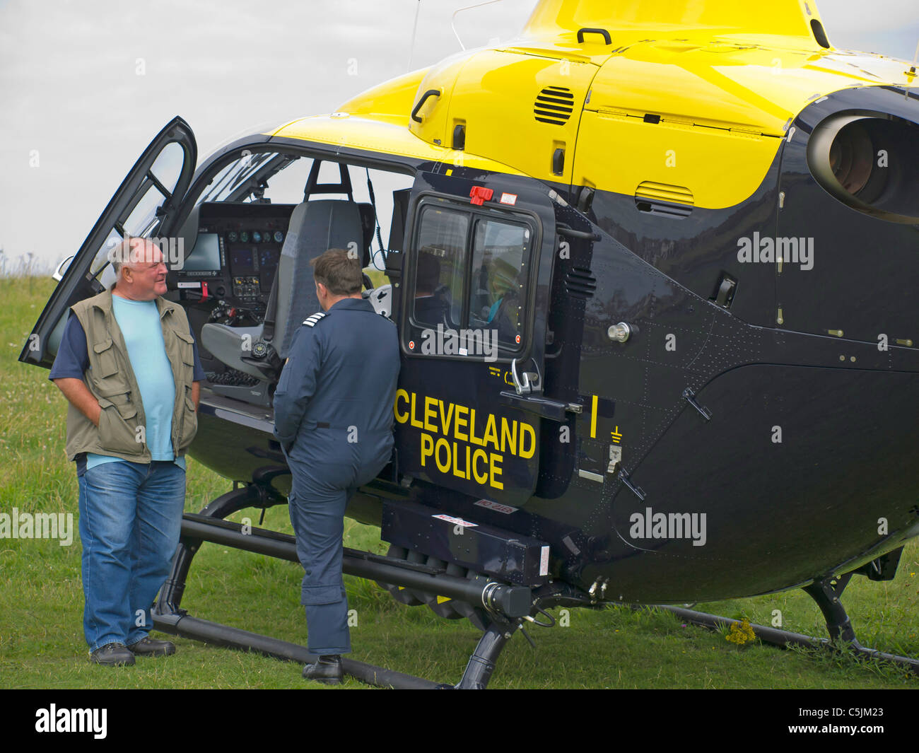 Policeman talking to man hi-res stock photography and images - Alamy