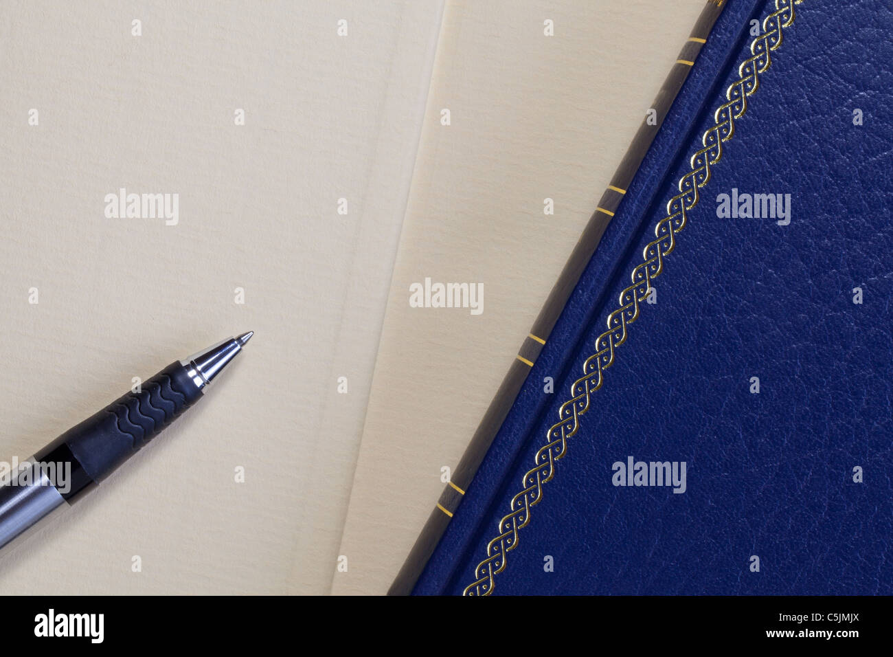 Blue Book with Pen Stock Photo - Alamy