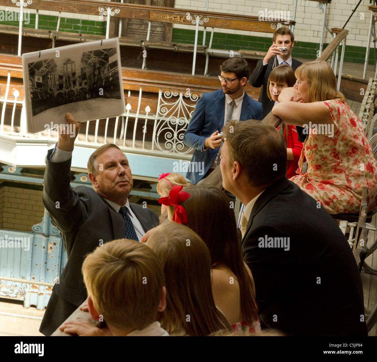 Guide tour illustrating the old Victoria baths pictures to visitors ...