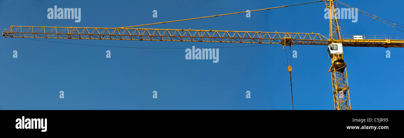 A static yellow crane on a construction site in Vienna, Austria Stock ...