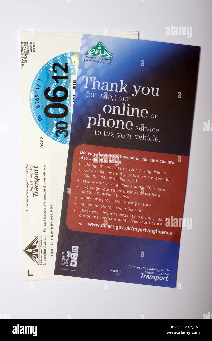 UK vehicle tax disc brought online Stock Photo - Alamy