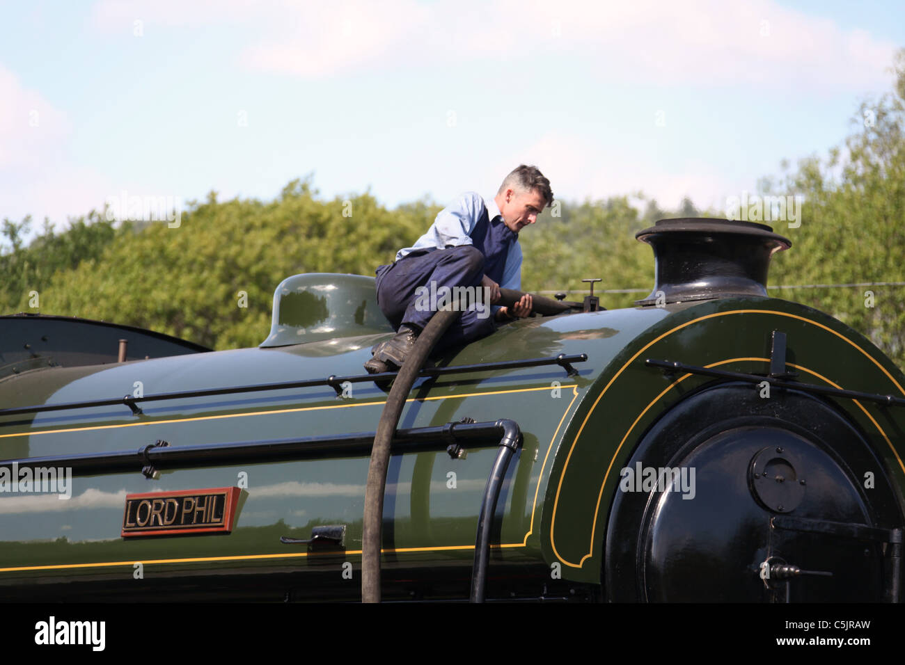 Steam train filling water hi-res stock photography and images - Alamy