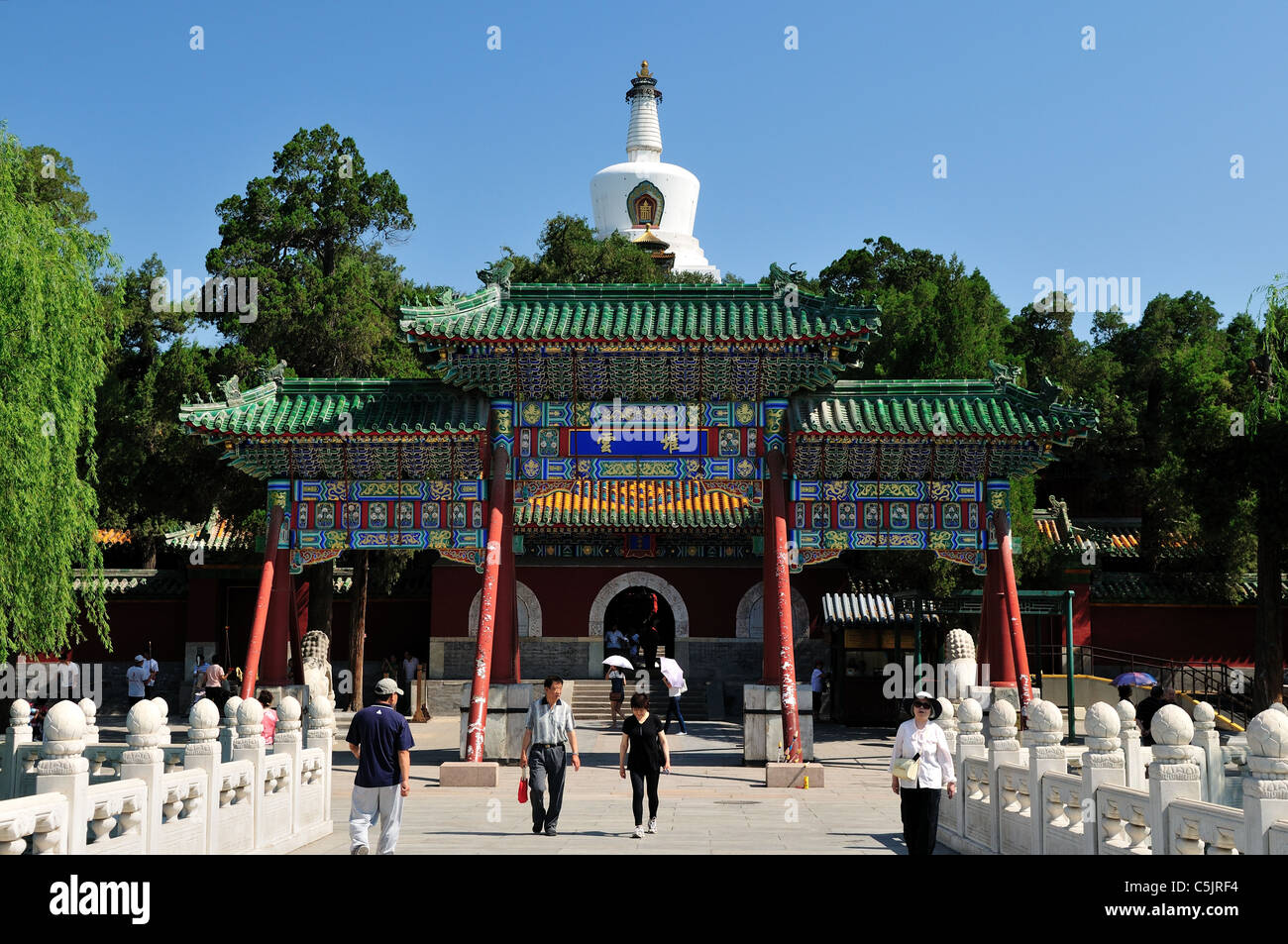 Colorful Pailou and white tower at Beihai park. Beijing, China Stock ...