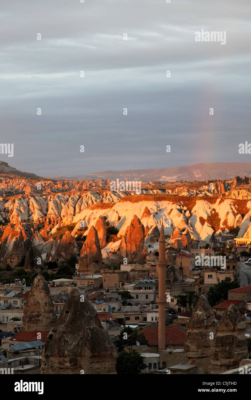 early morning sunray, rainbow over Goreme valley with cloudy sky ...