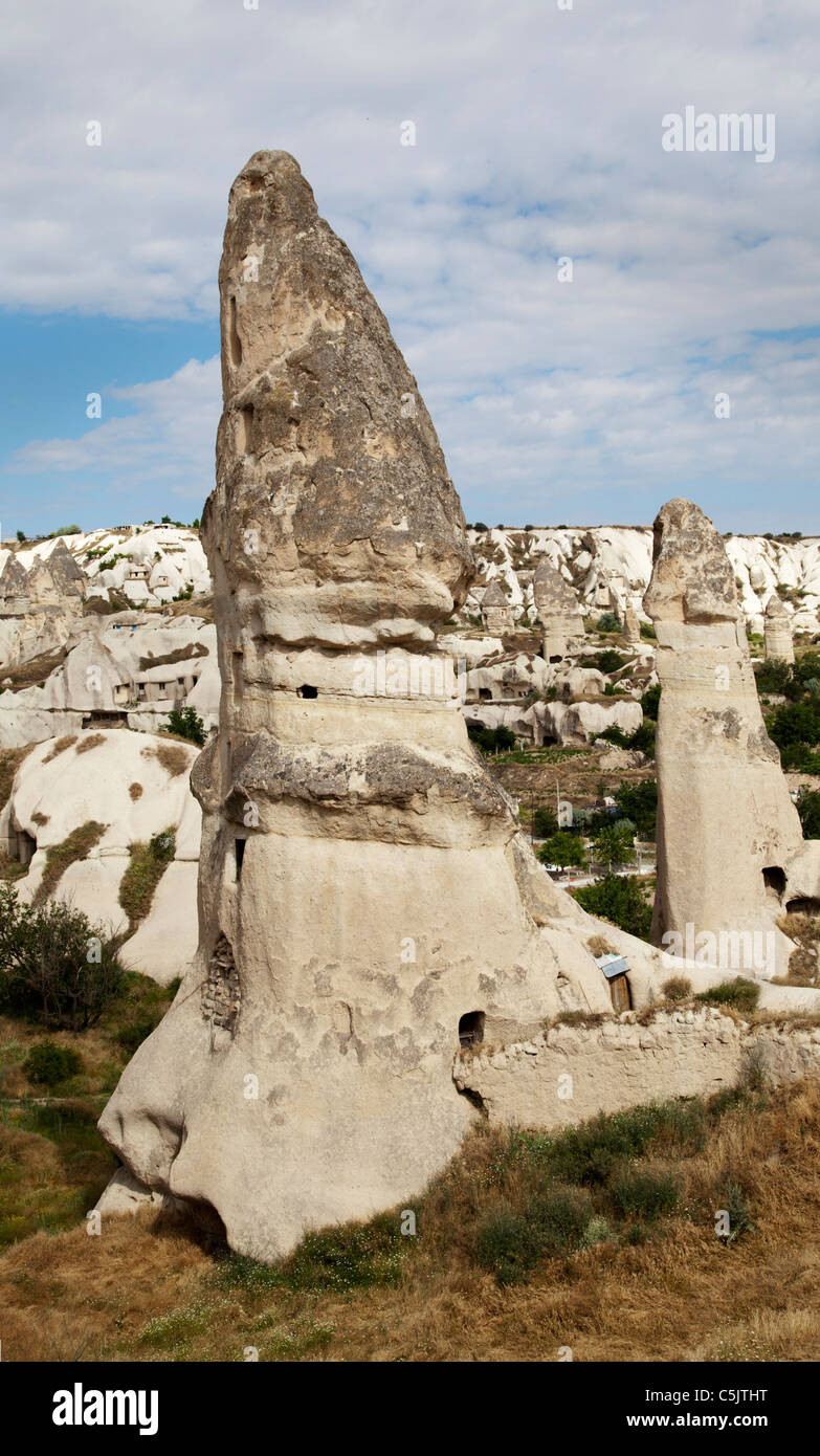 limestone fairy chimneys with a limestone cliff as a backdrop, portrait ...