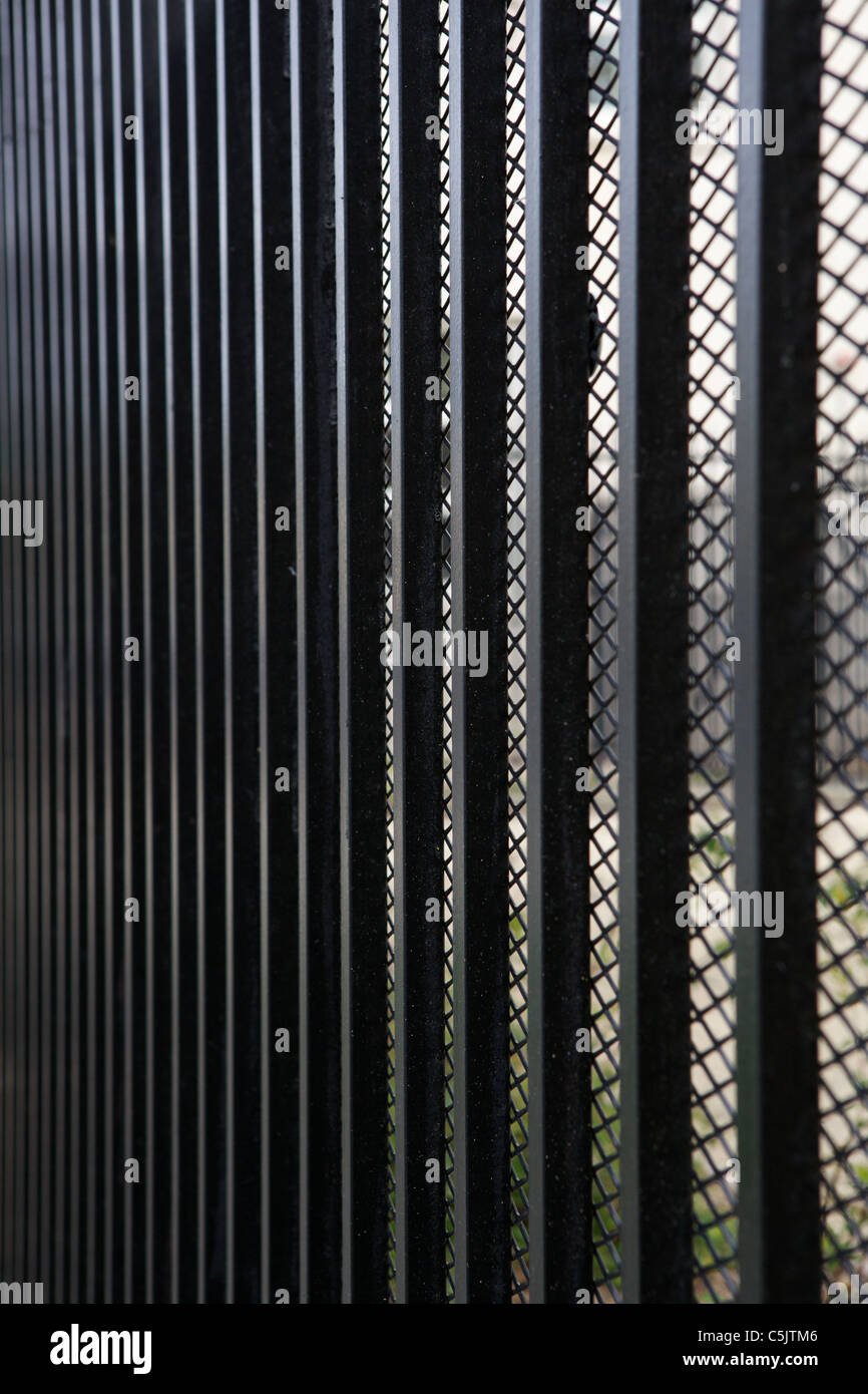 Diminishing image of vertical black steel bars Stock Photo - Alamy