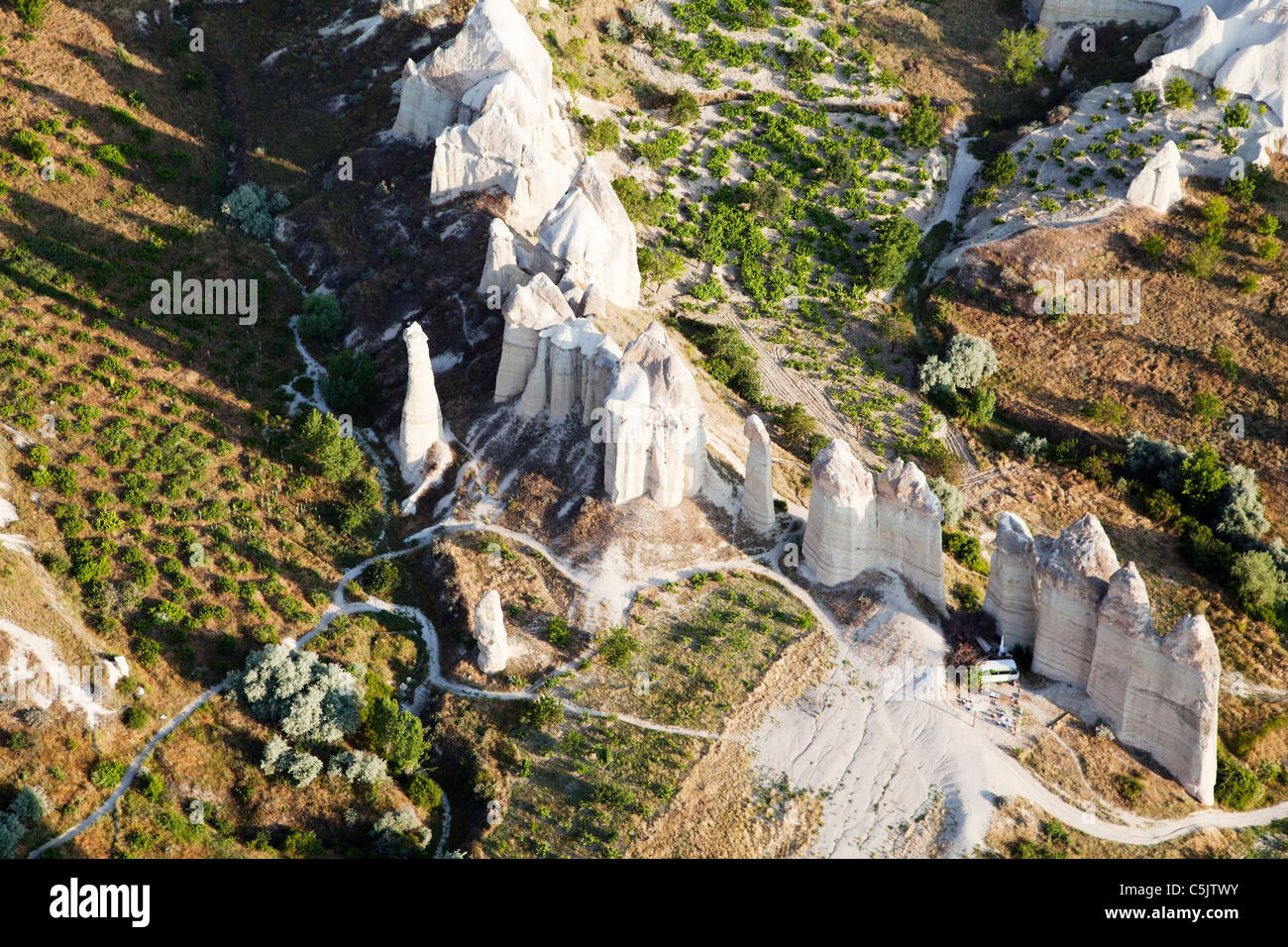 aerial shot of weathered limestone forming chimneys, Cappadocia, Turkey ...