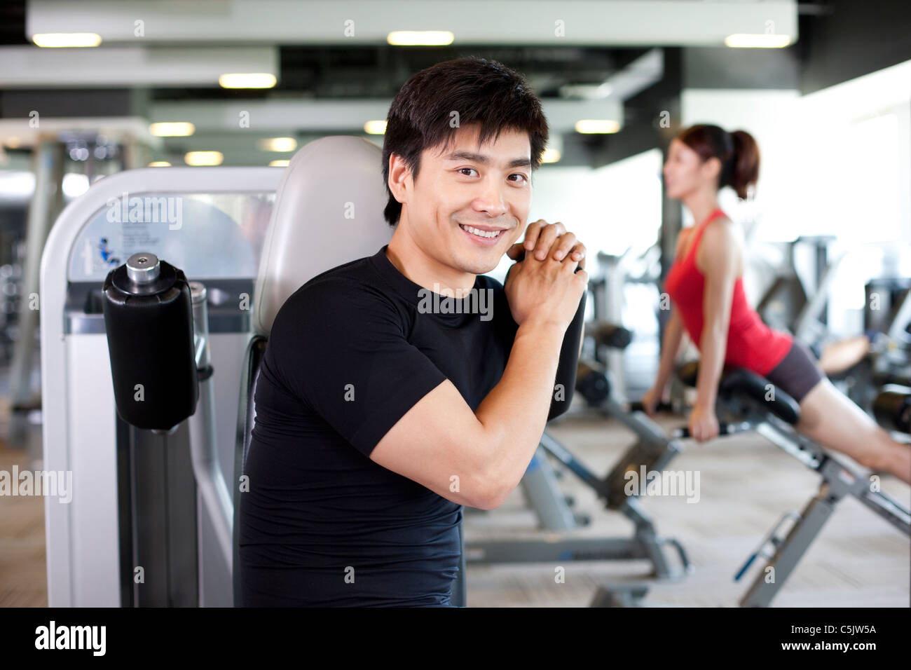 Young Man Happy at Gym Stock Photo - Alamy
