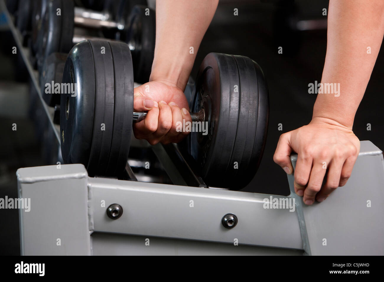Strong Hands Picking up Weights Stock Photo - Alamy