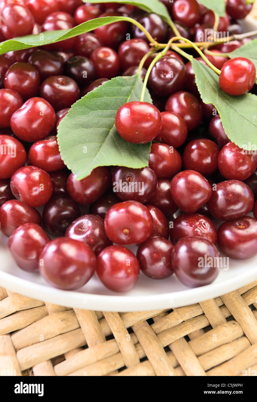 cherries,ripe berries and green leaves Stock Photo - Alamy
