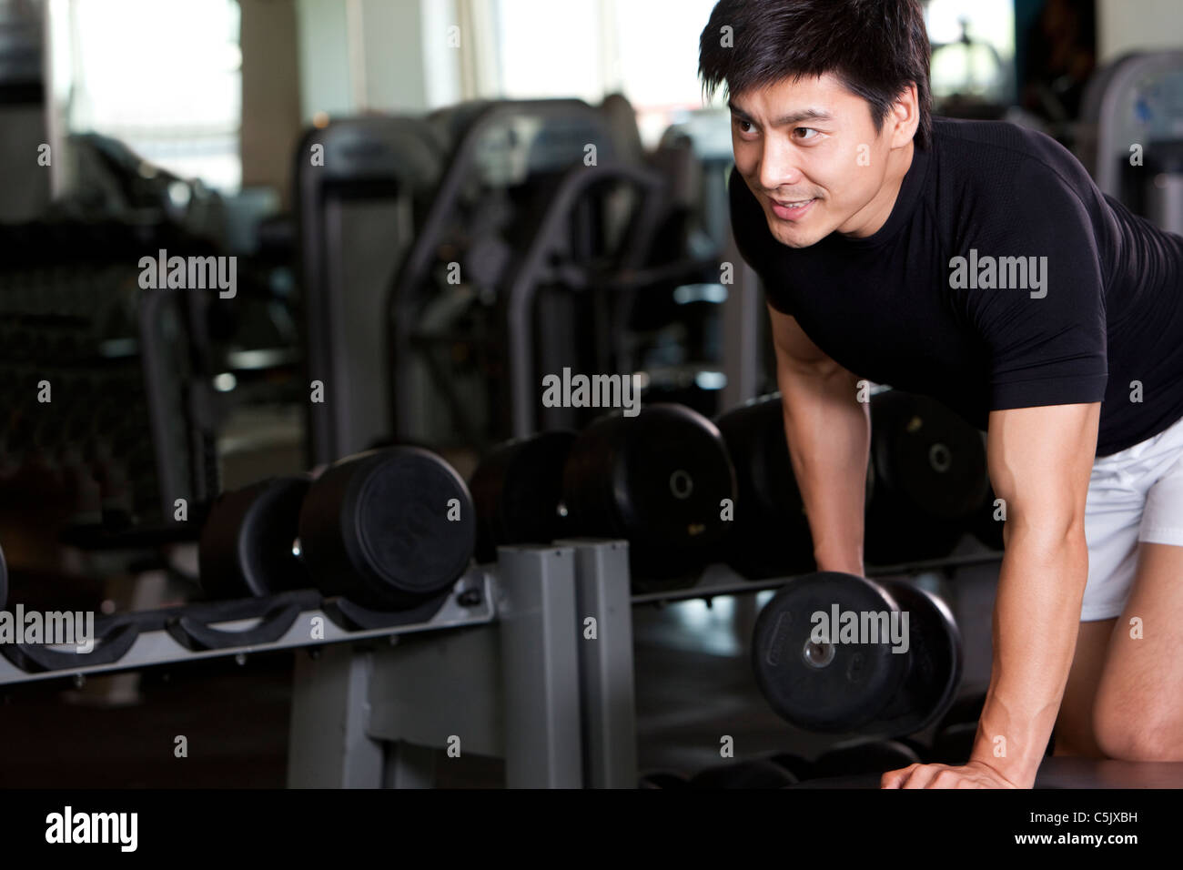 Mid-Adult Man Lifting Weights Stock Photo - Alamy