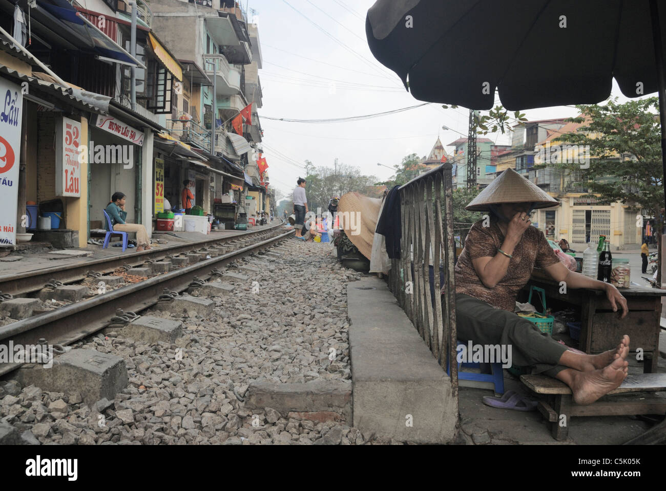 Asia, Vietnam, Hanoi. Railway track leading through Hanoi's centre ...