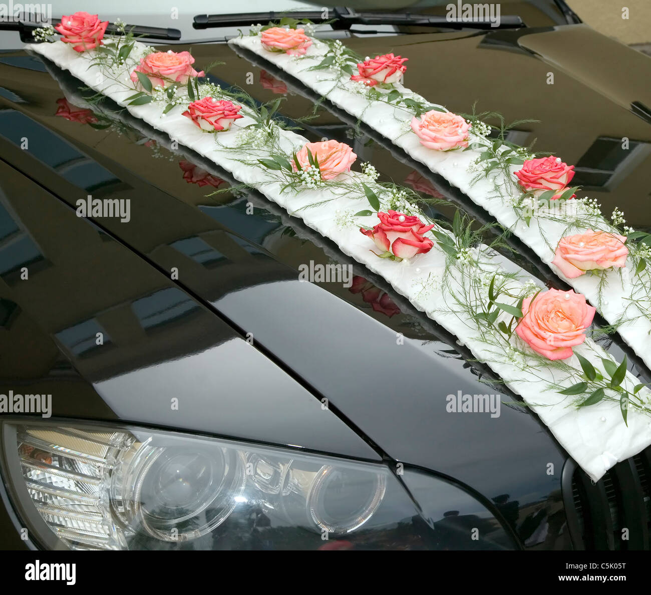 Car with decorations from flower for driving bride and groom during ...