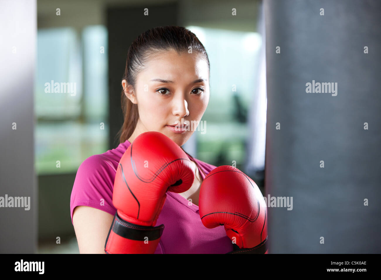 Confident Young Woman in Boxing Gloves Stock Photo - Alamy
